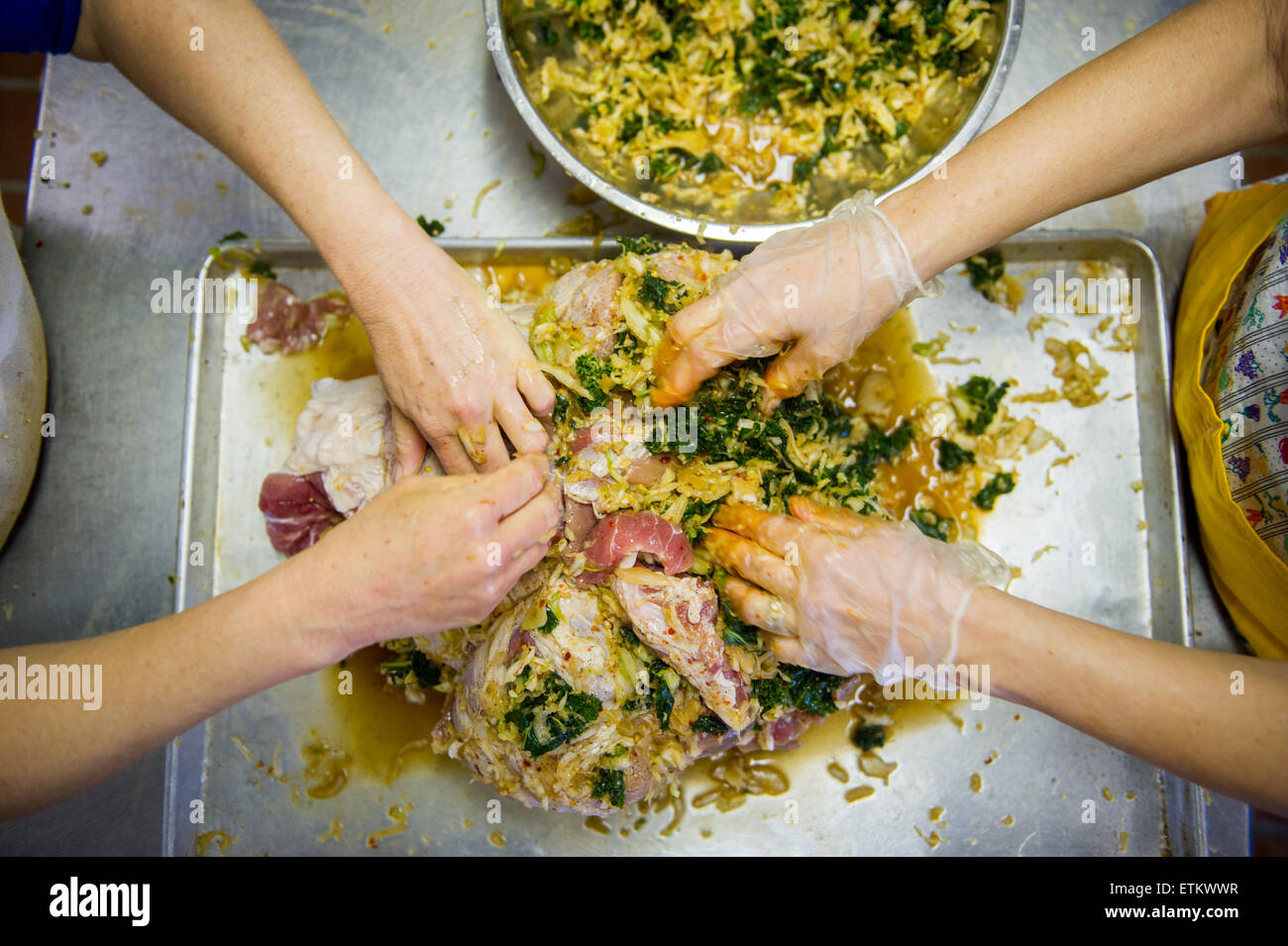 People stuffing hams in St Mary's County Maryland, USA Stock Photo - Alamy