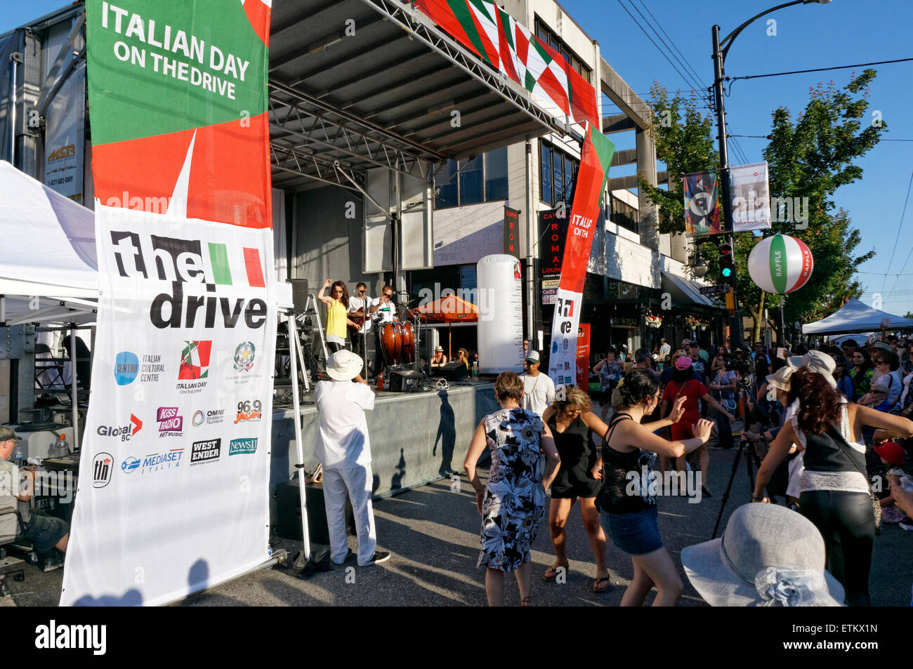 People dance in front of a stage at the sixth annual Italian Day ...
