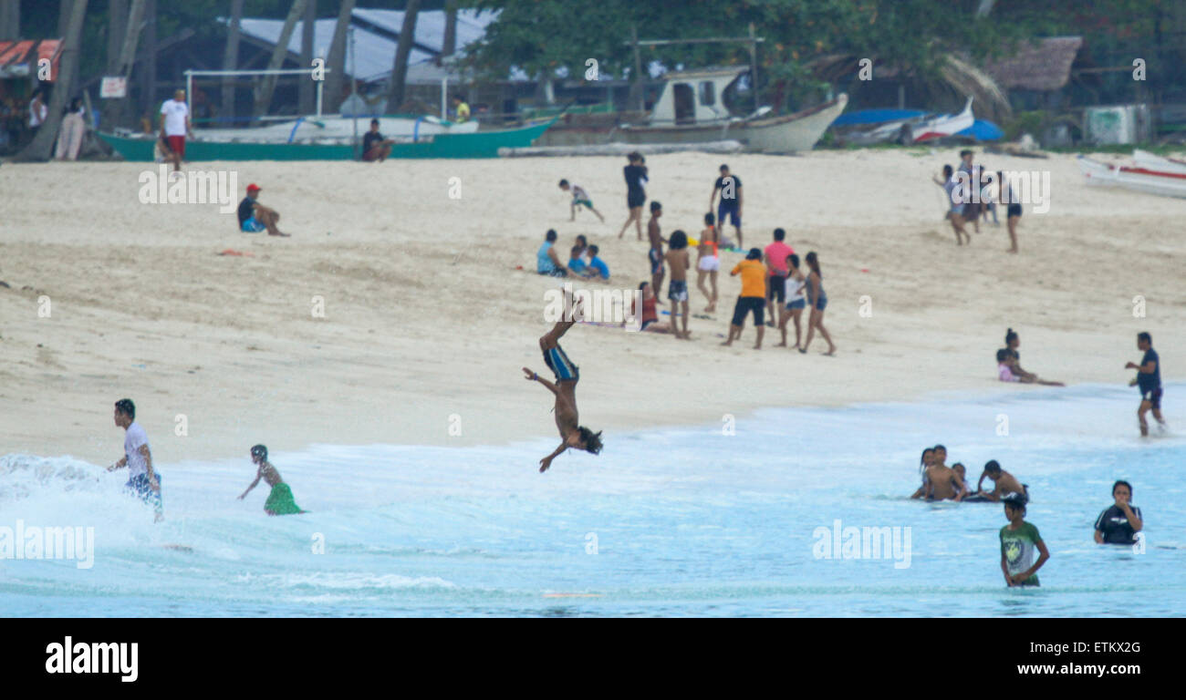Philippines. 14th June, 2015. Beach goers enjoying at Dahican Beach ...