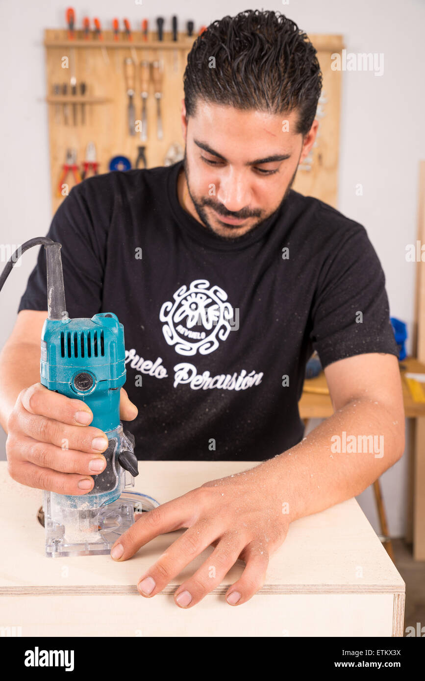 Milling machine being used to craft a cajon flamenco percussion ...