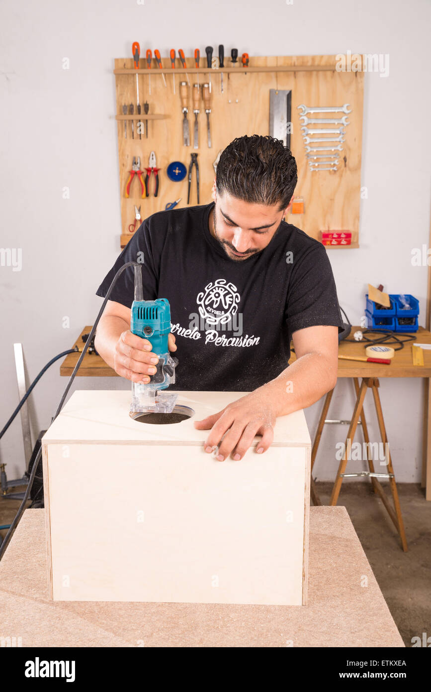Milling machine being used to craft a cajon flamenco percussion ...
