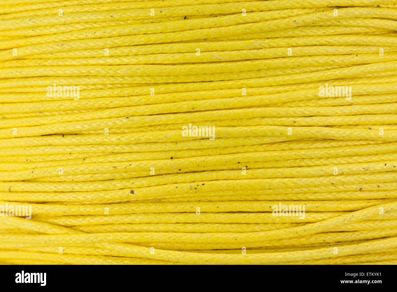 background of yellow rope whip on roll Stock Photo - Alamy