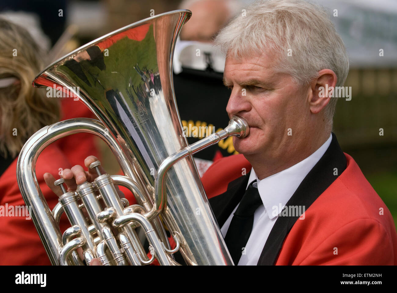 Member of Farnham Brass Band entertaining the crowds at Churt fete ...