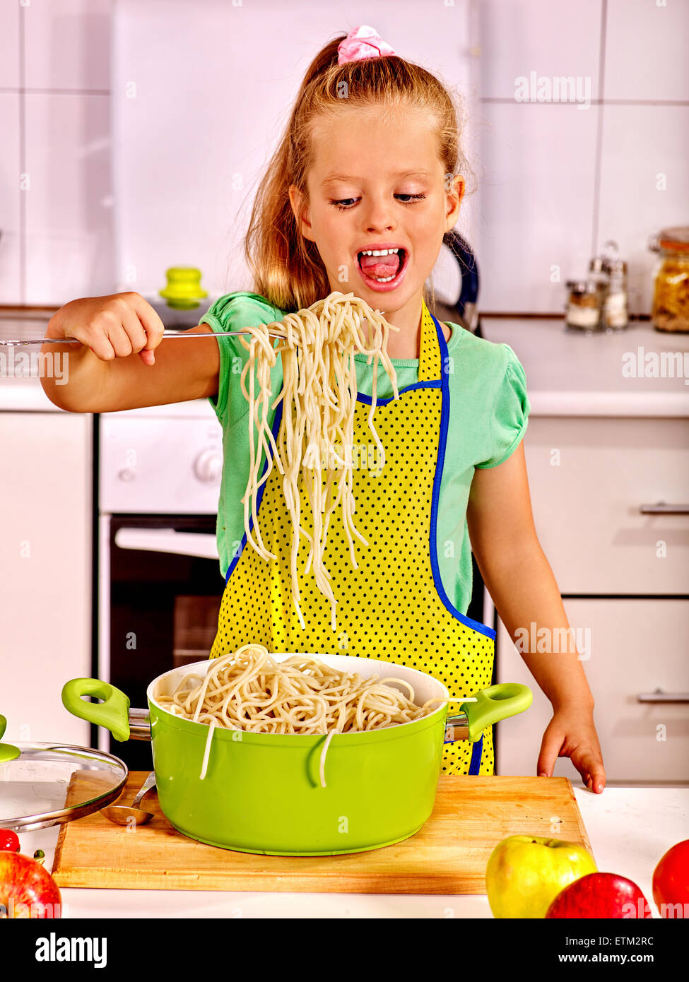 Kid cooking at kitchen Stock Photo - Alamy