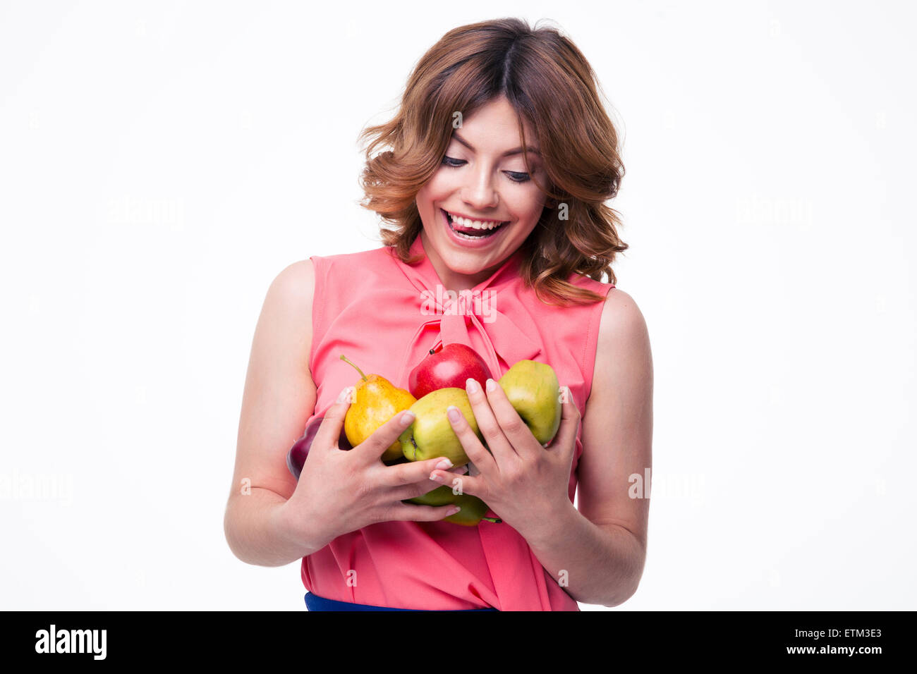 Happy beautiful woman holding fruits isolated on a white background ...