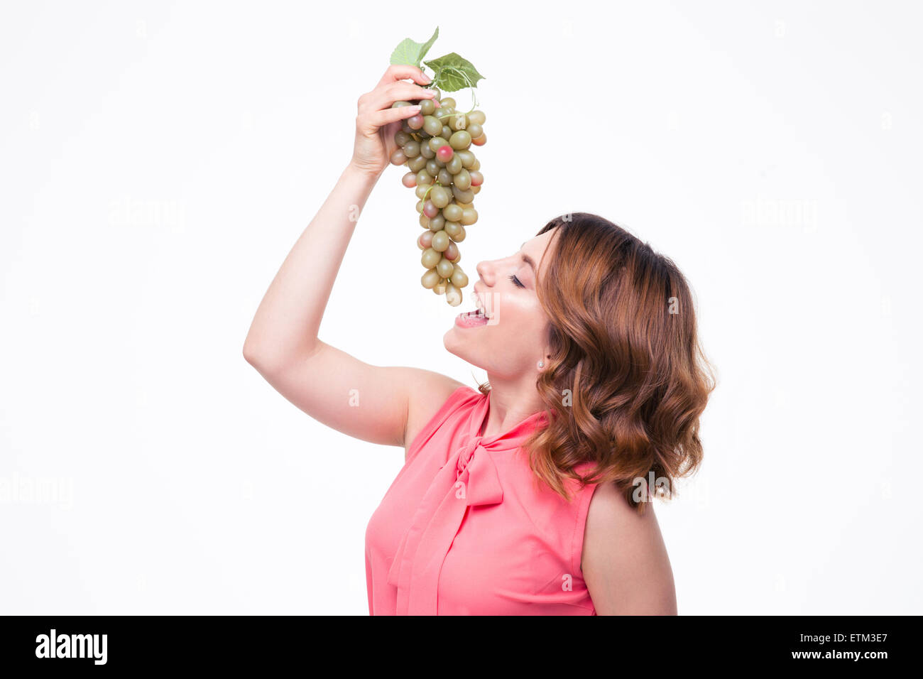 Woman eating grapes hi-res stock photography and images - Alamy