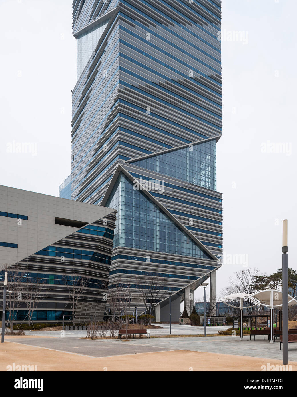 Exterior facade with triangular fenestration voids. G-Tower in Incheon ...