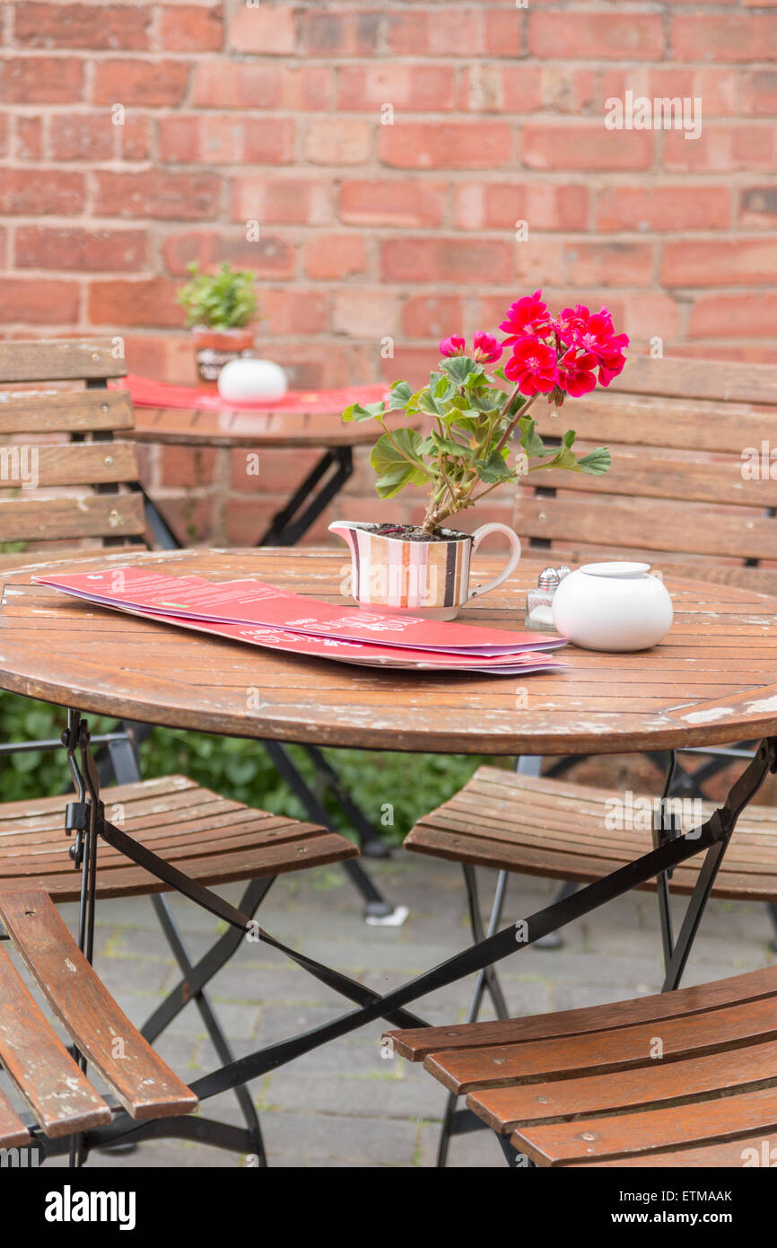 Café table with flowers Stock Photo - Alamy