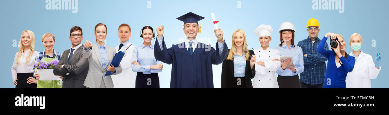 happy bachelor with diploma over professionals Stock Photo - Alamy