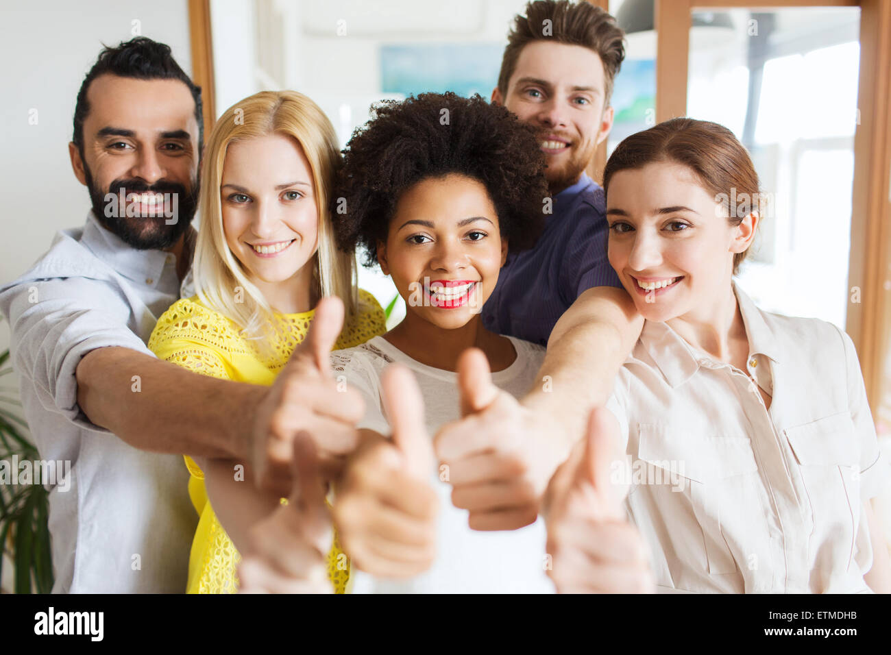 Team creative designers showing thumbs hi-res stock photography and images - Alamy