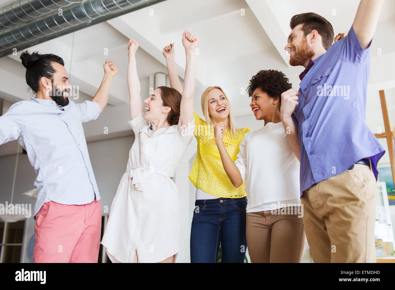 happy creative team in office Stock Photo - Alamy