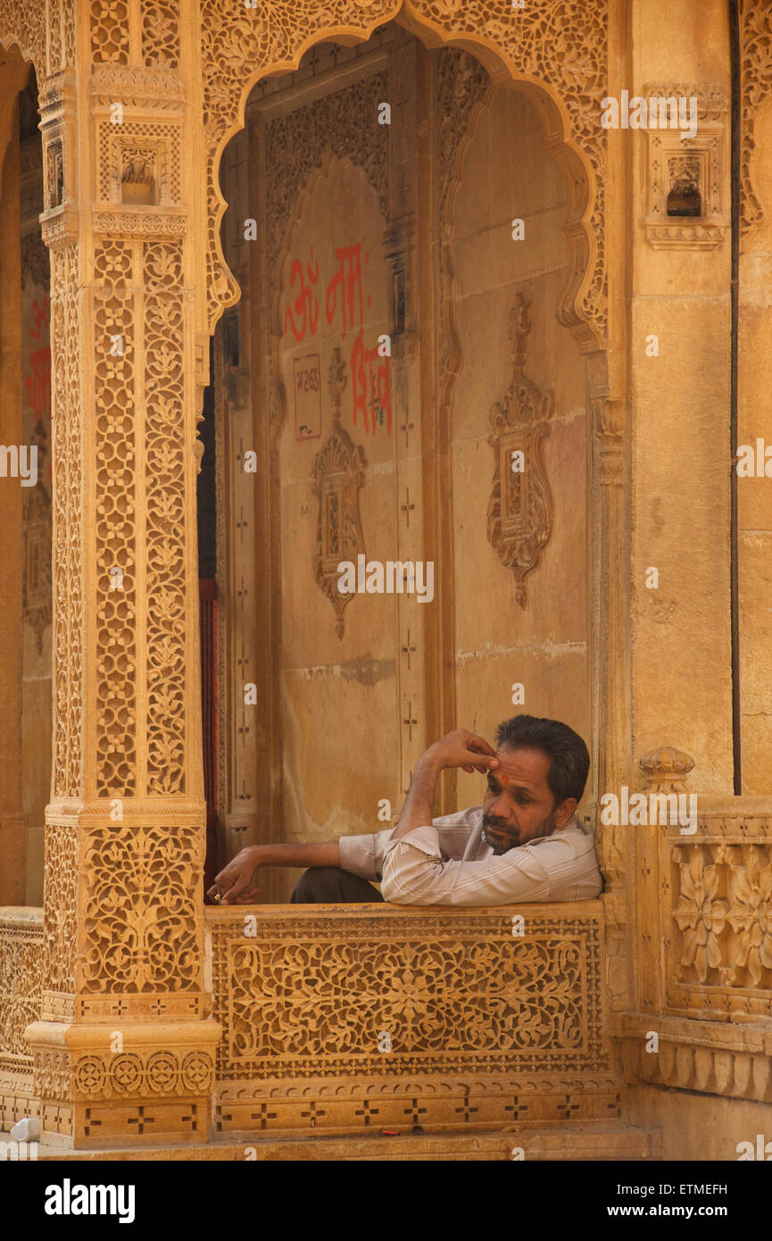 Man sitting outside temple hi-res stock photography and images - Alamy