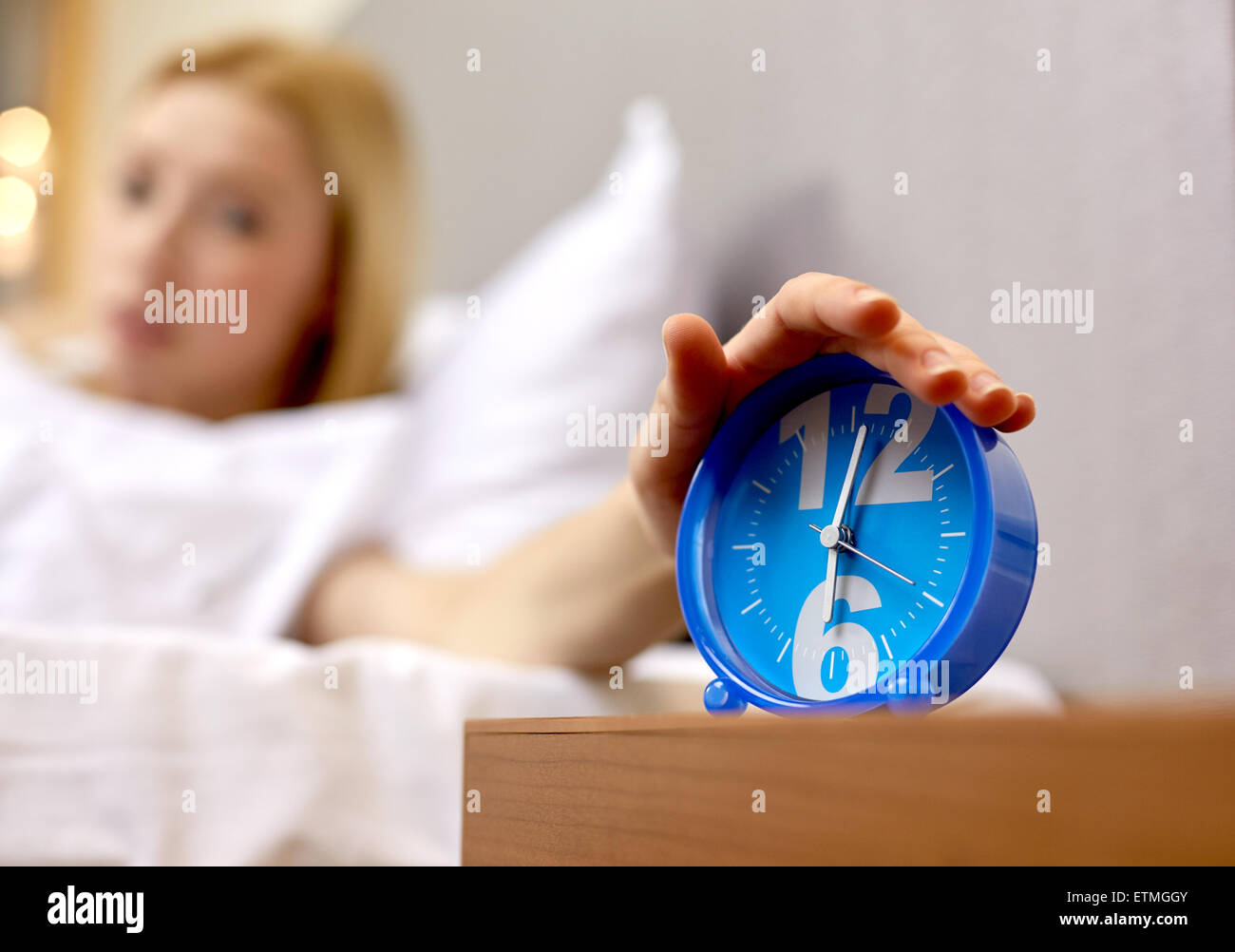 close up of hand on alarm clock in bedroom Stock Photo - Alamy