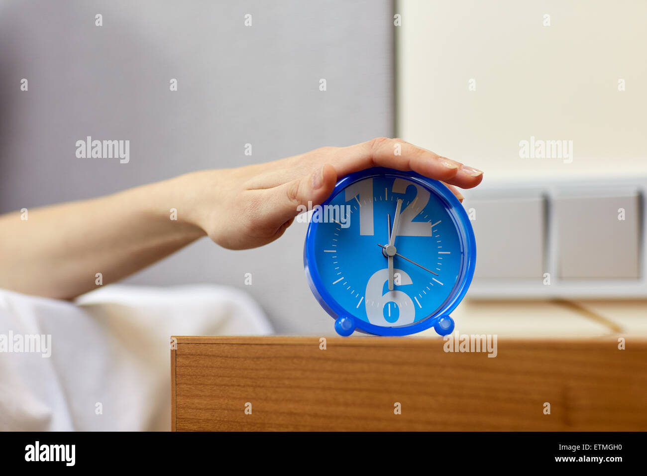 Hand on alarm clock hi-res stock photography and images - Alamy