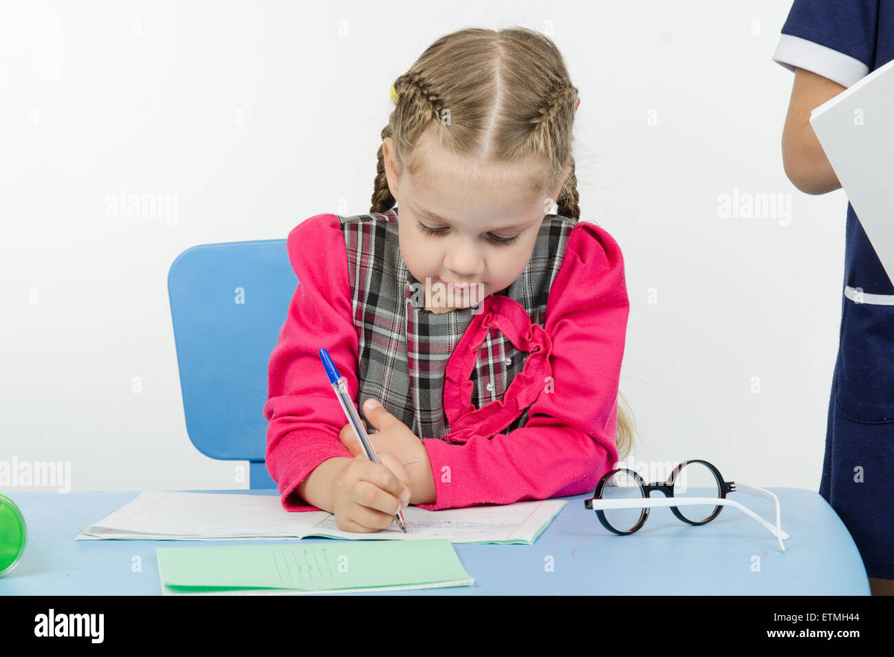 Two girls play school teacher and student Stock Photo - Alamy