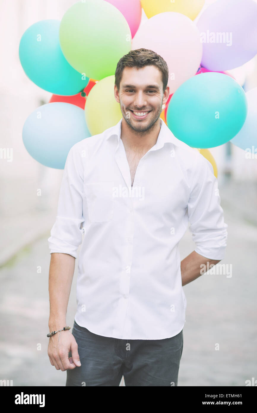 Man flying helium balloons hi-res stock photography and images - Alamy
