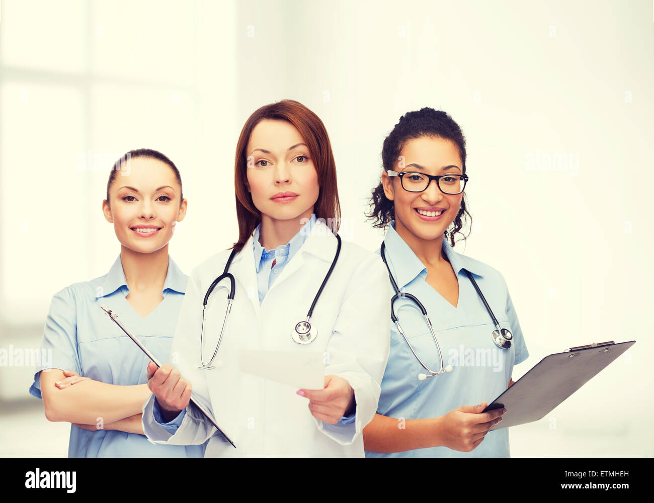 calm female doctor with clipboard Stock Photo - Alamy