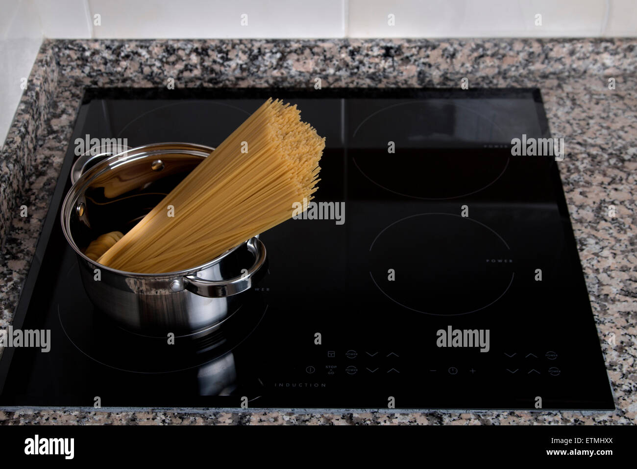 Close up view of pile spaghetti inside a pan Stock Photo - Alamy