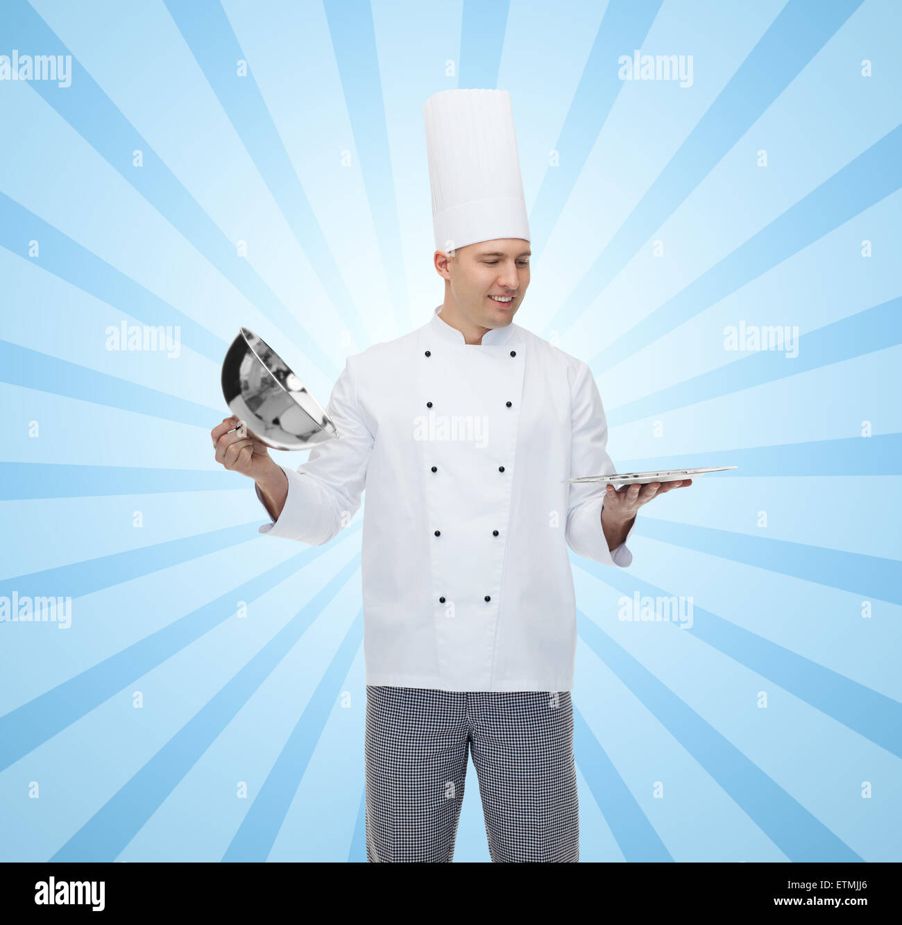happy male chef cook opening cloche Stock Photo - Alamy