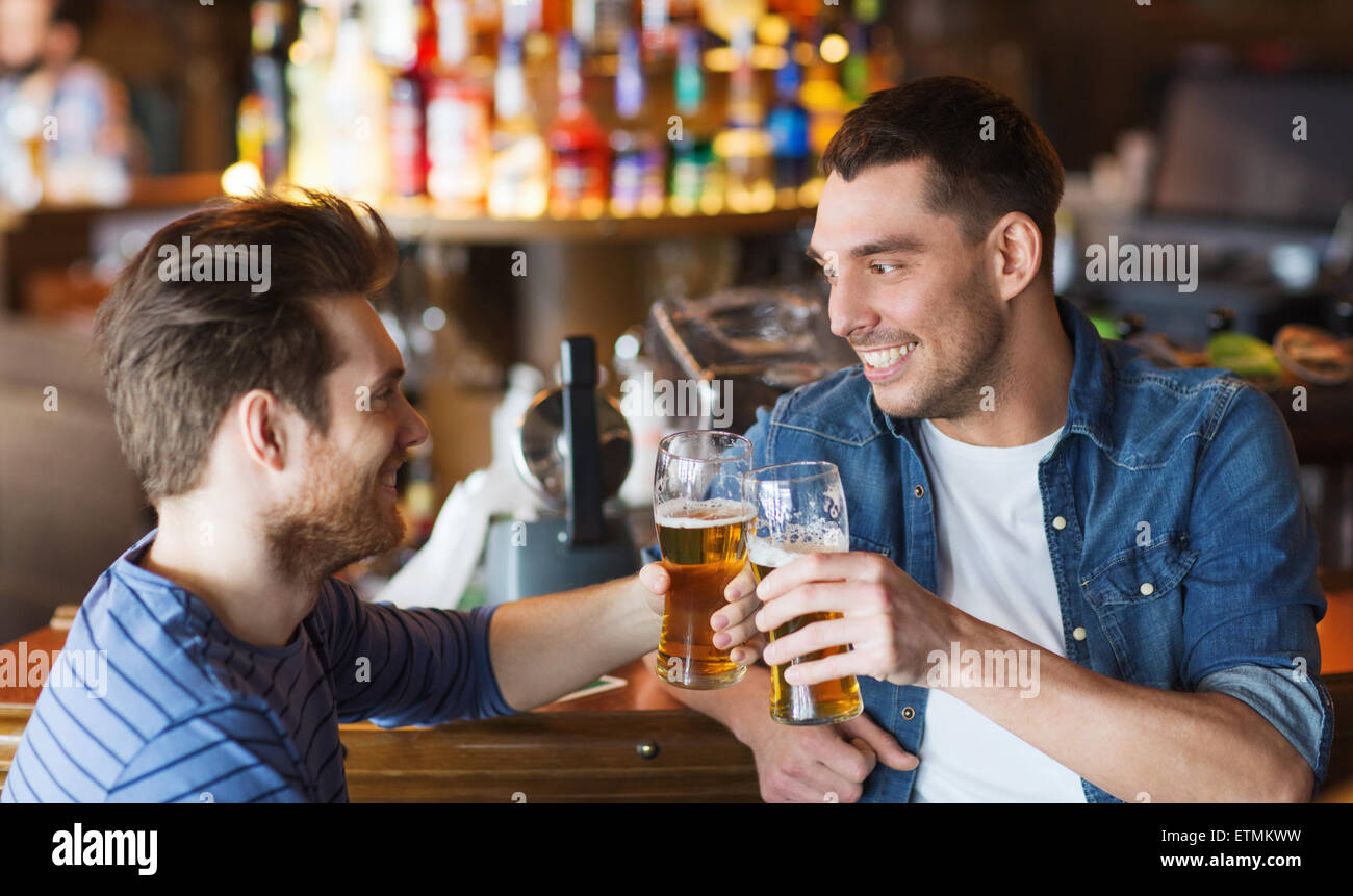 Group male friends clinking hi-res stock photography and images - Alamy