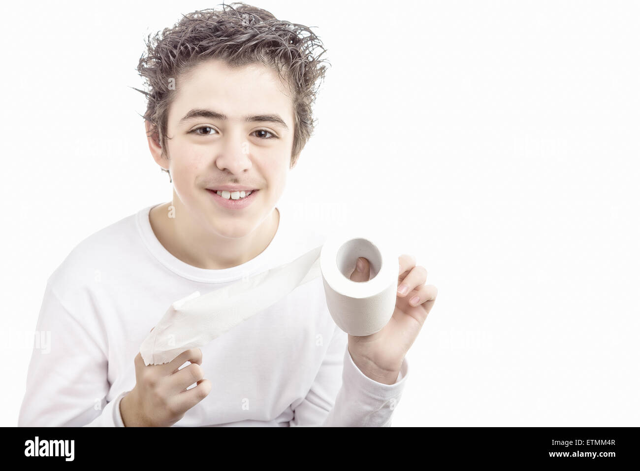 A cute Hispanic boy holds a blank white toilet paper roll with right ...