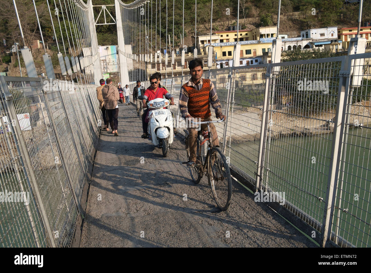 Traffic on Ram Jula bridge over Ganges river in Rishikesh Stock Photo ...