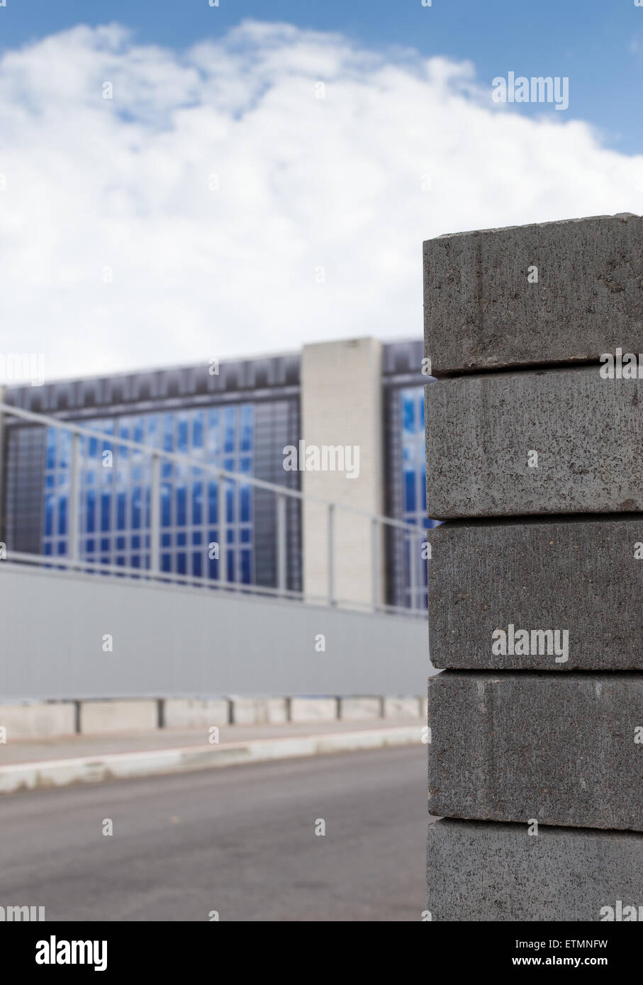 Grey concrete bricks and a modern building in background Stock Photo ...