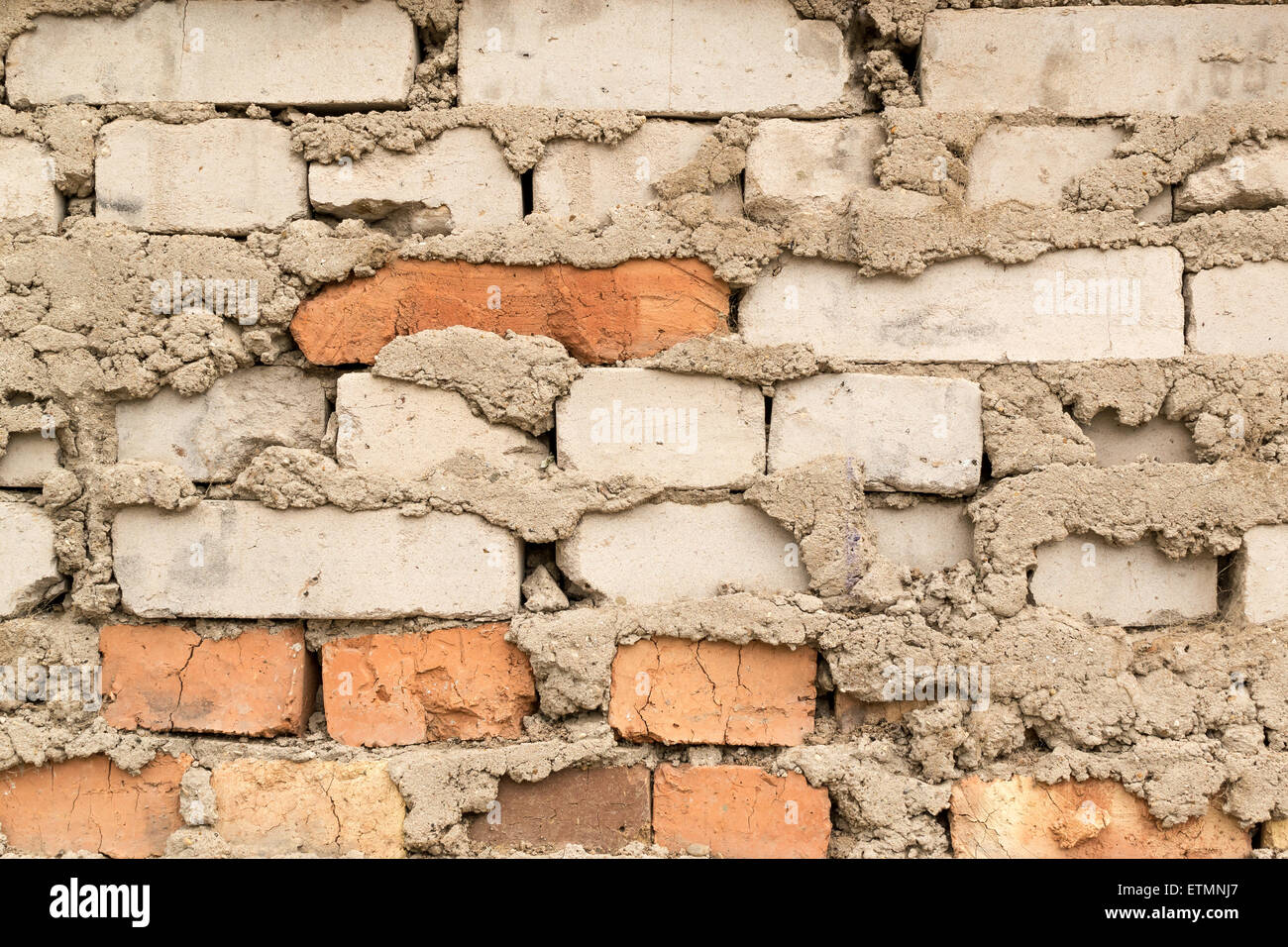 Bodged brick wall with messy loose cement Stock Photo - Alamy