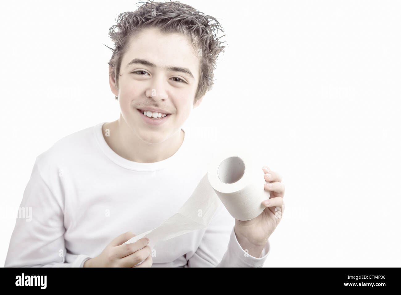 A cute Hispanic boy holds a blank white toilet paper roll with right ...