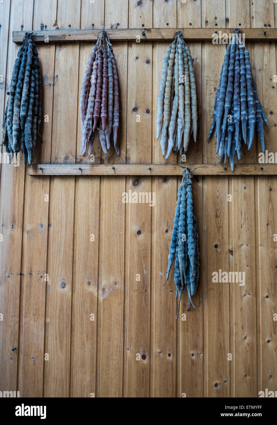 traditional sausage-shaped Georgian candy called churchkhela on a stand ...