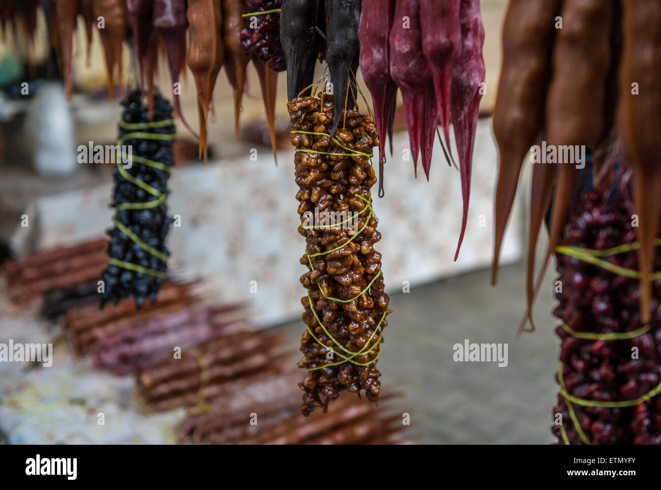 traditional sausage-shaped Georgian candy called churchkhela on a stand ...