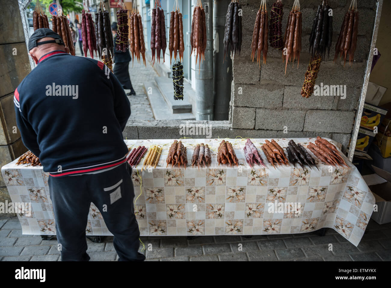 traditional sausage-shaped Georgian candy called churchkhela on a stand ...