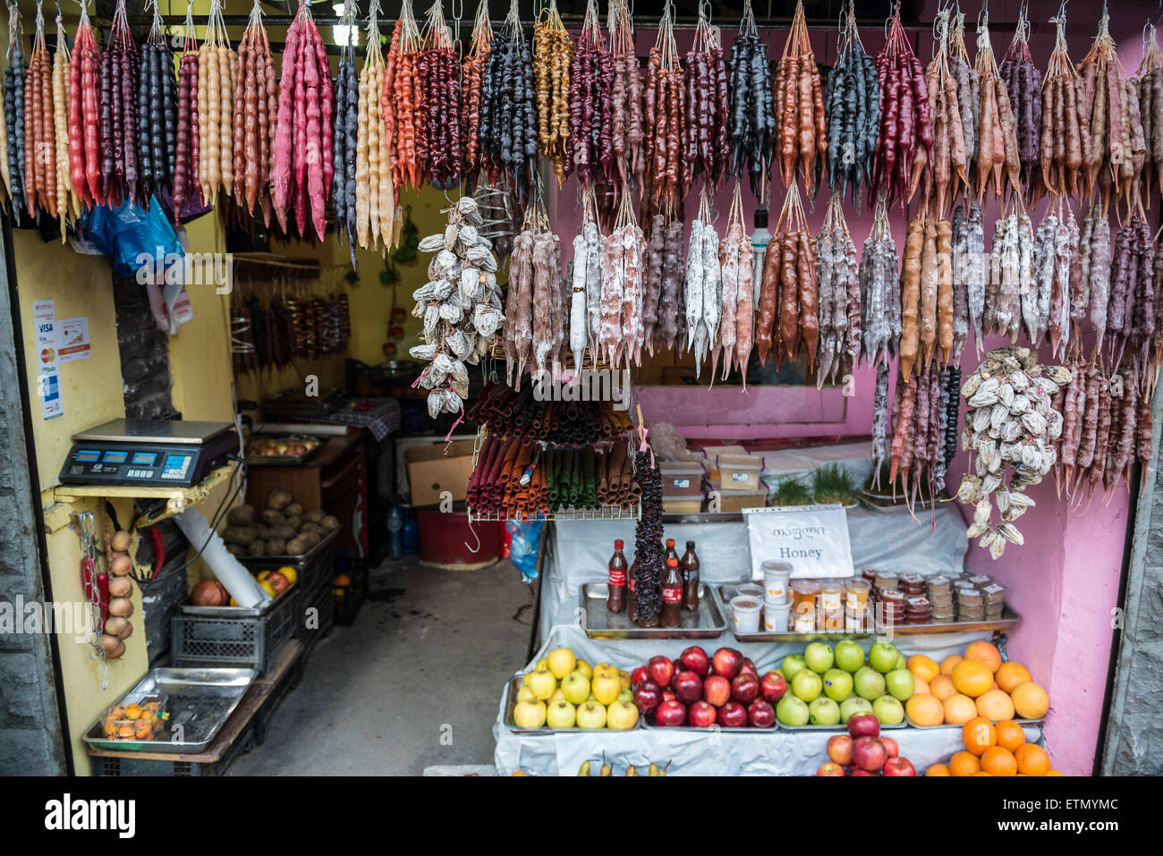 traditional sausage-shaped Georgian candy called churchkhela on a stand ...