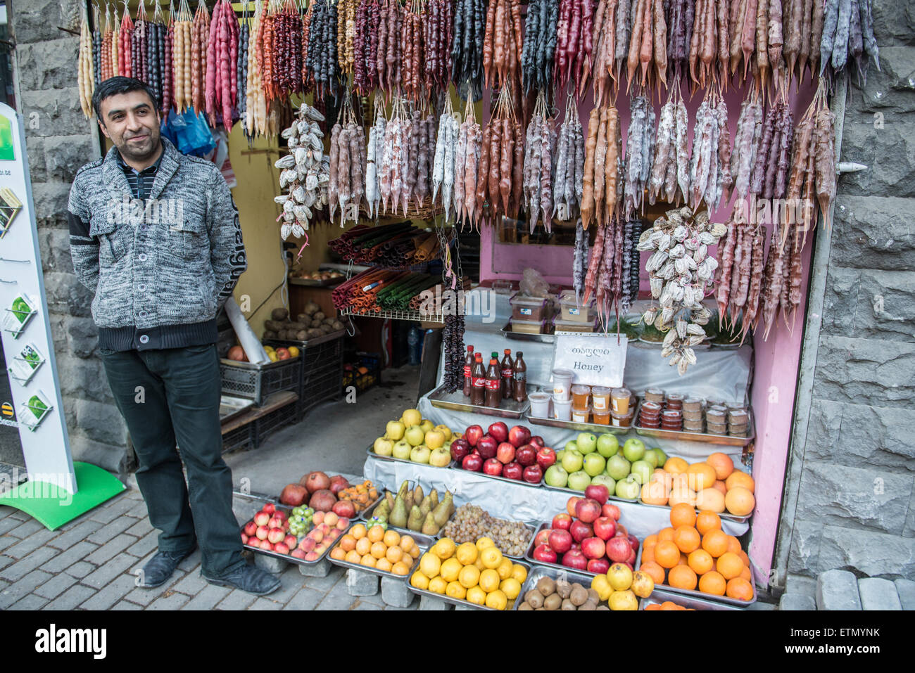traditional sausage-shaped Georgian candy called churchkhela on a stand ...