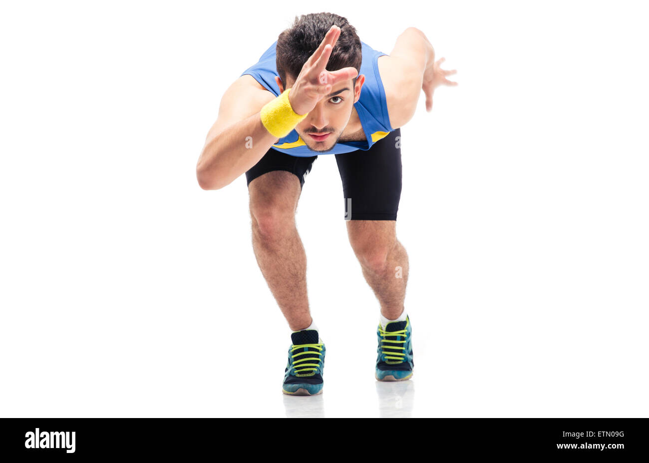Sports man getting ready to run isolated on a white background Stock ...