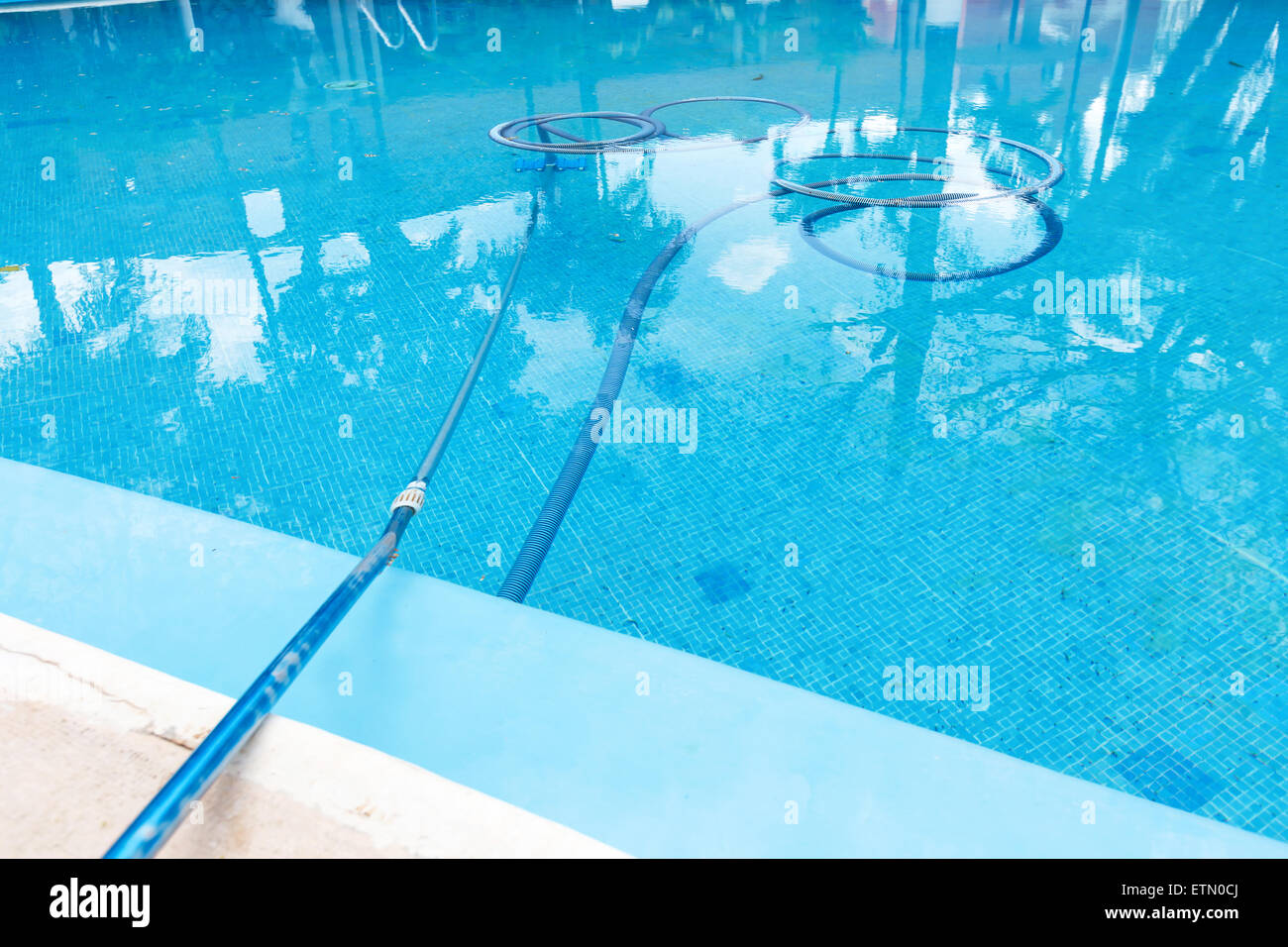 Process of cleaning swimming pool. Outdoors Stock Photo - Alamy