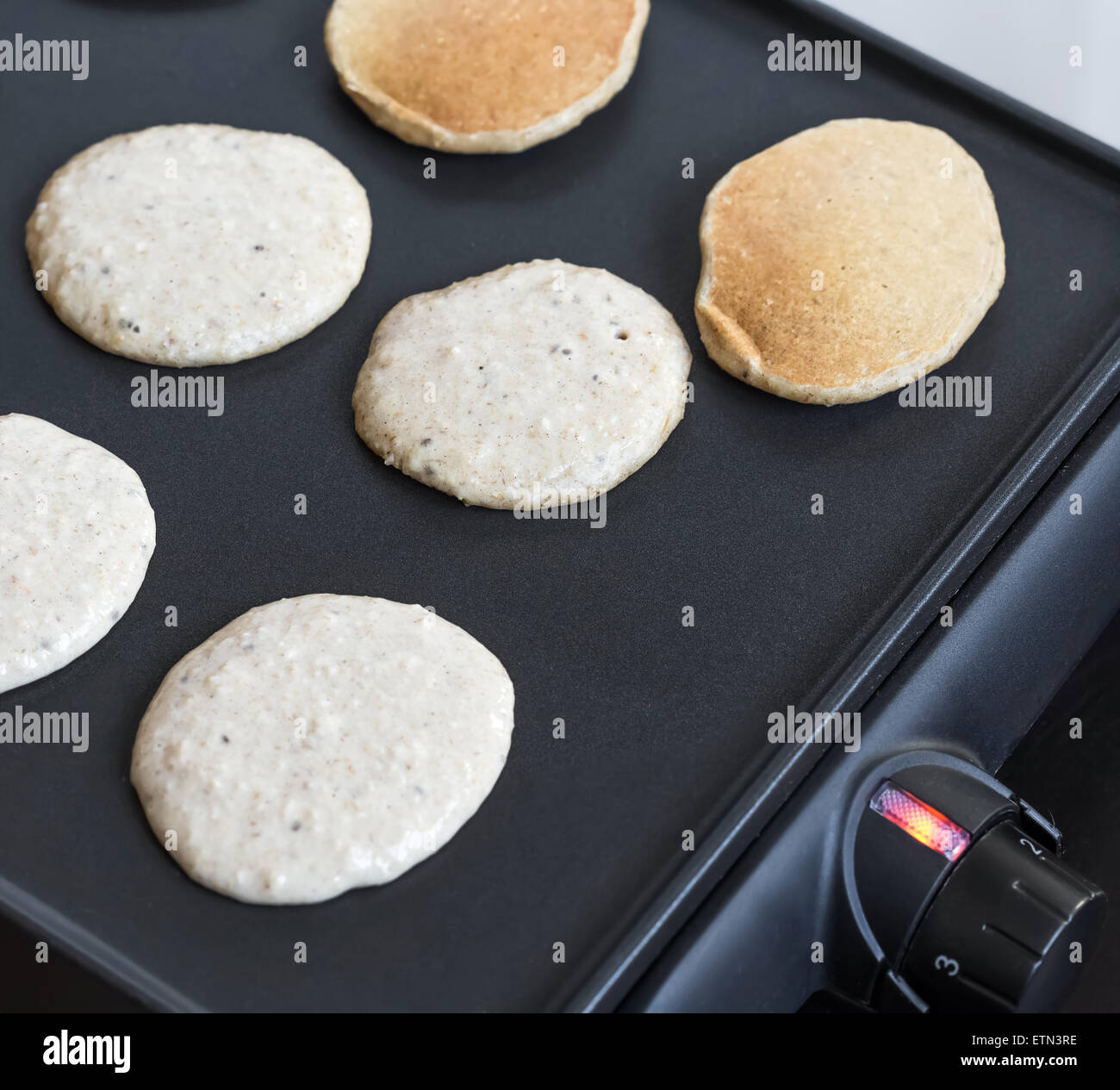 Oat pancakes cooking on electric barbecue, closeup Stock Photo - Alamy