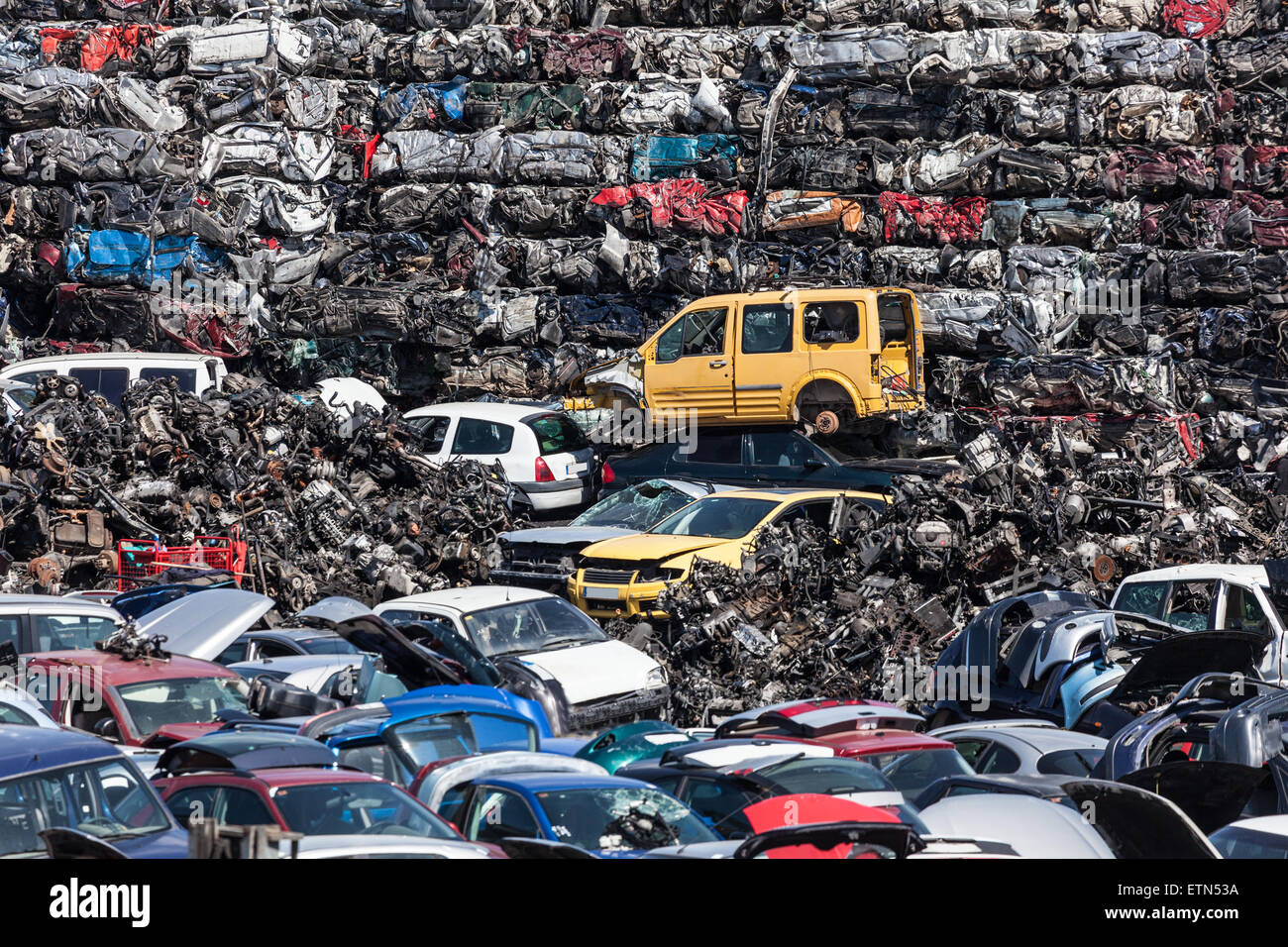 Stacked wrecked cars going to be shredded in a recycling plant Stock ...