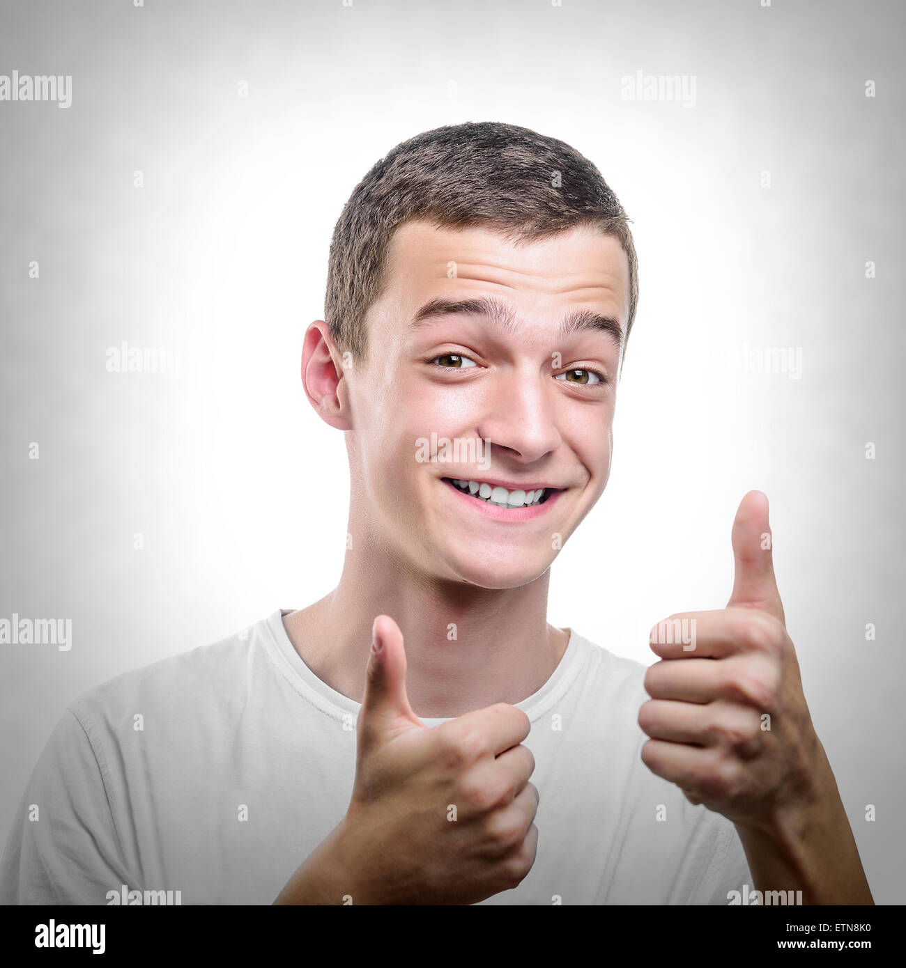 Handsome man with thumb up Stock Photo - Alamy