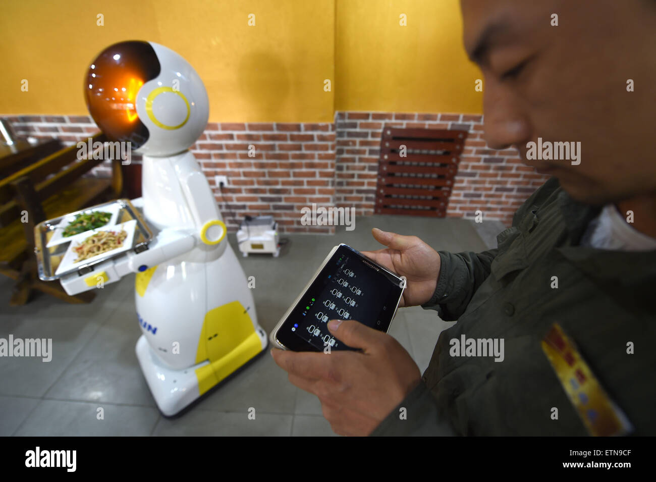 China robot waiter hi-res stock photography and images - Alamy