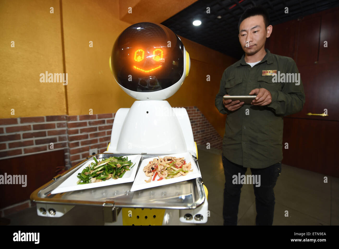 China robot waiter hi-res stock photography and images - Alamy
