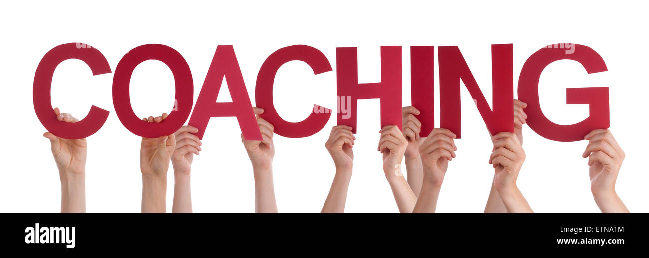 Hands Holding Red Word Coaching Stock Photo - Alamy