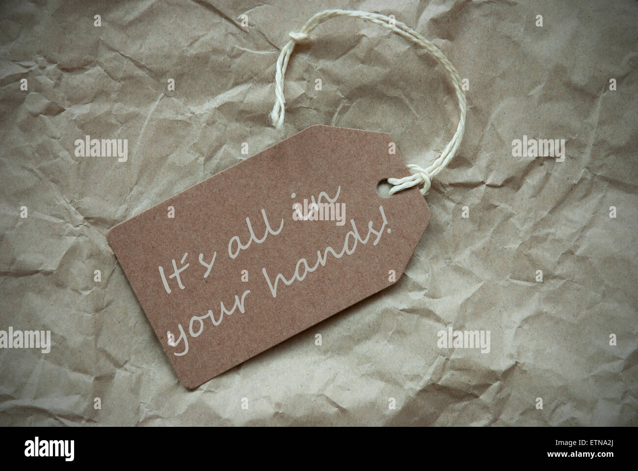 Beige Label With Quote Its In Your Hands Stock Photo - Alamy