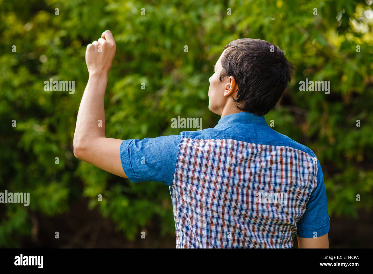man back writing hand in the air on a green background street tr Stock ...