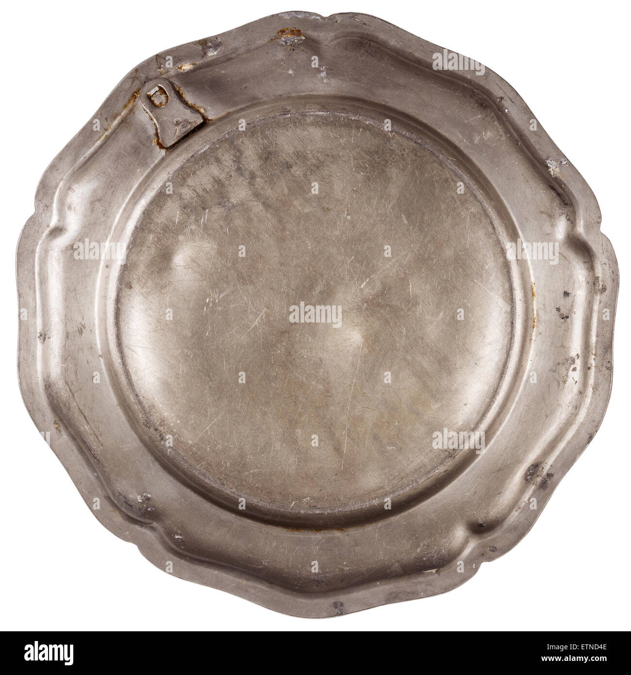 Bottom of old pewter plate isolated on white background Stock Photo - Alamy