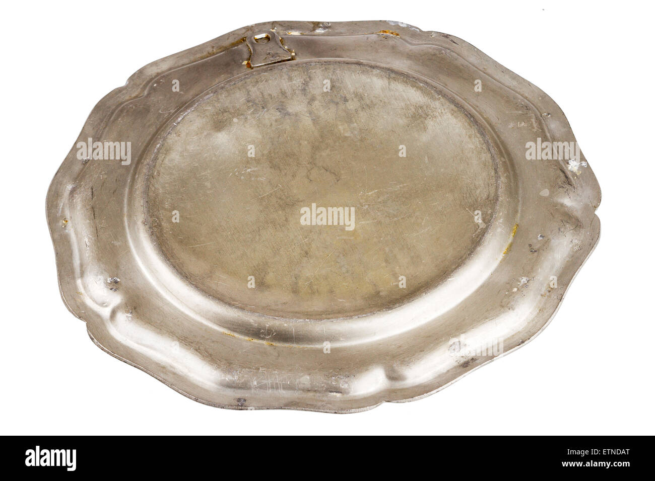 Bottom of old pewter plate isolated on white background Stock Photo - Alamy