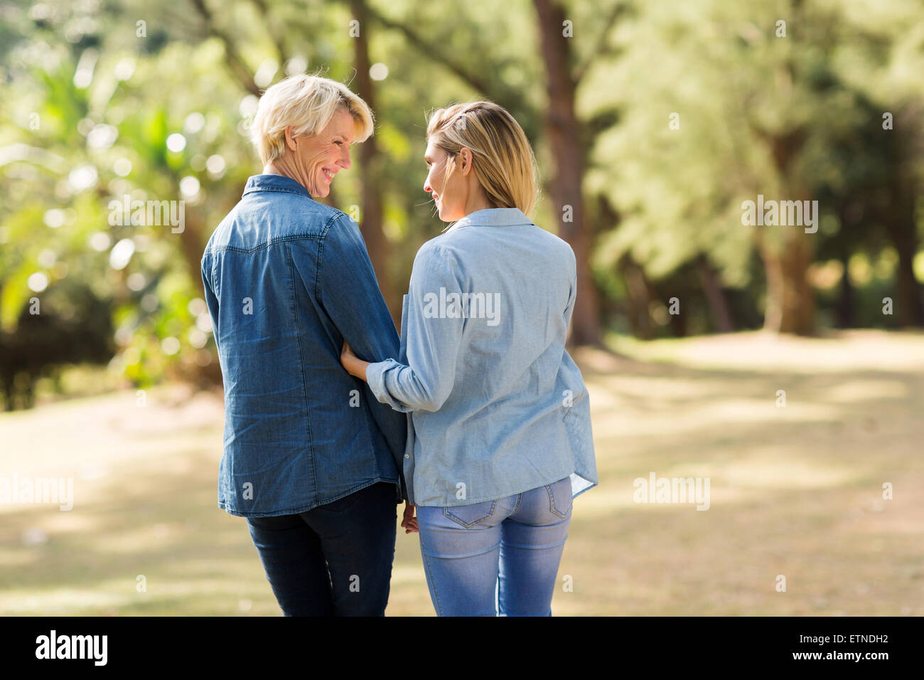 back view of mother and daughter walking outdoors Stock Photo - Alamy