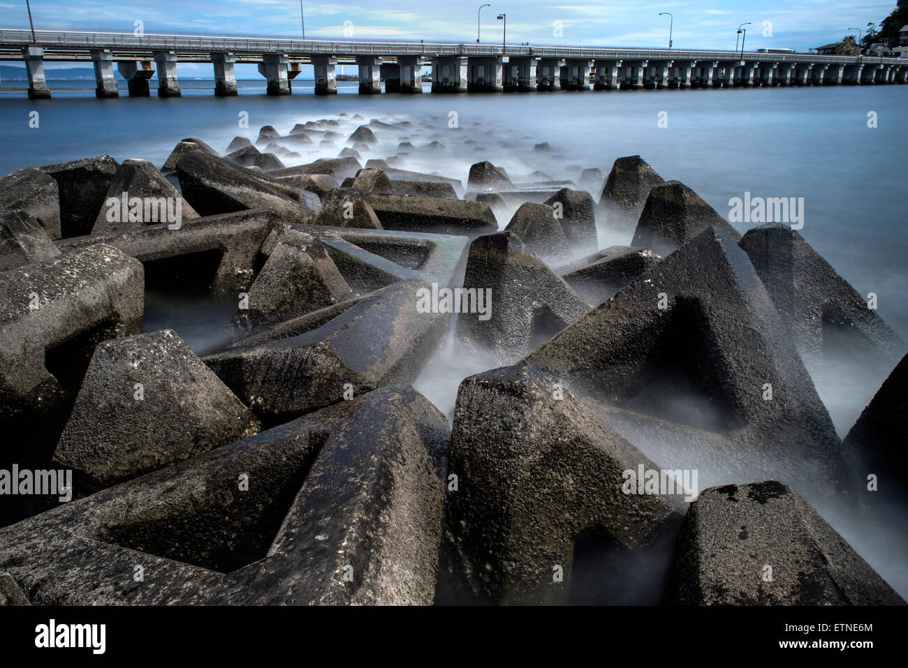 Wave breakers and road over the sea under clouded sky, Kanagawa ...