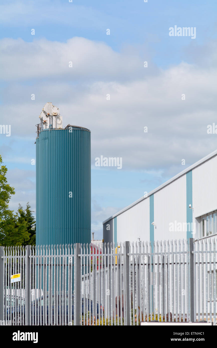 Cylindrical storage tank on industrial estate Stock Photo - Alamy