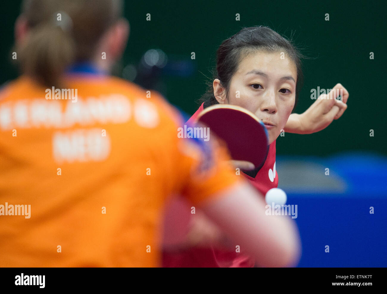 Germany's player Ying Han competes with Britt Eerland from the ...